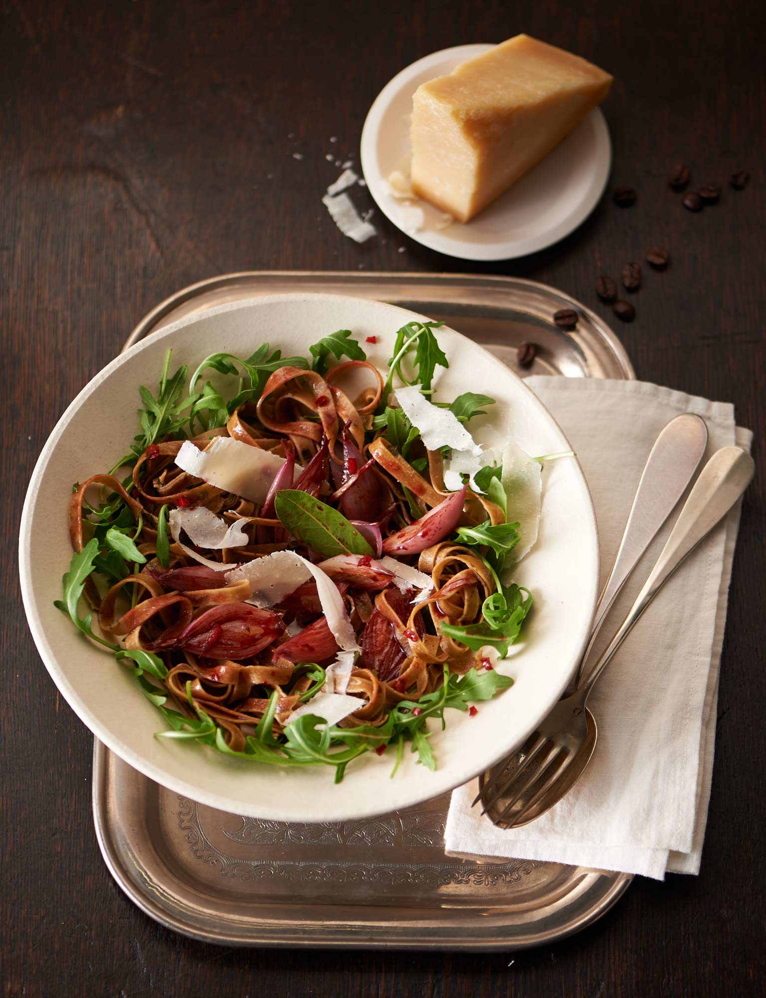 Espresso and thyme ribbon noodles on a bed of rocket